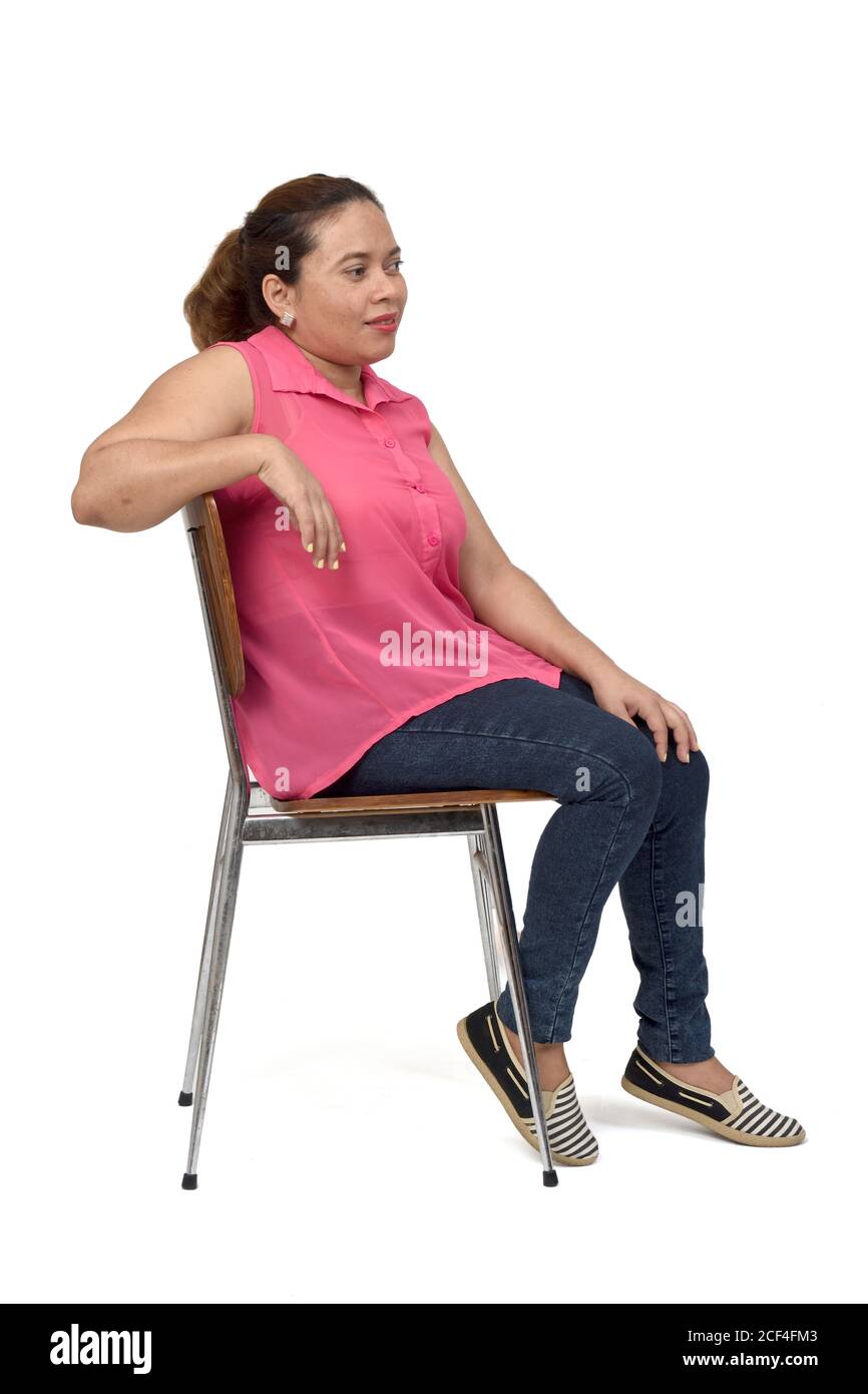 portrait of a woman sitting on a chair with the body in profile and ...