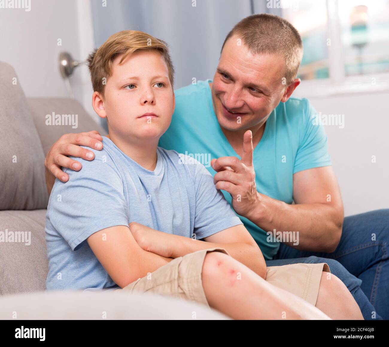 Teen boy talk father indoor hi-res stock photography and images - Alamy