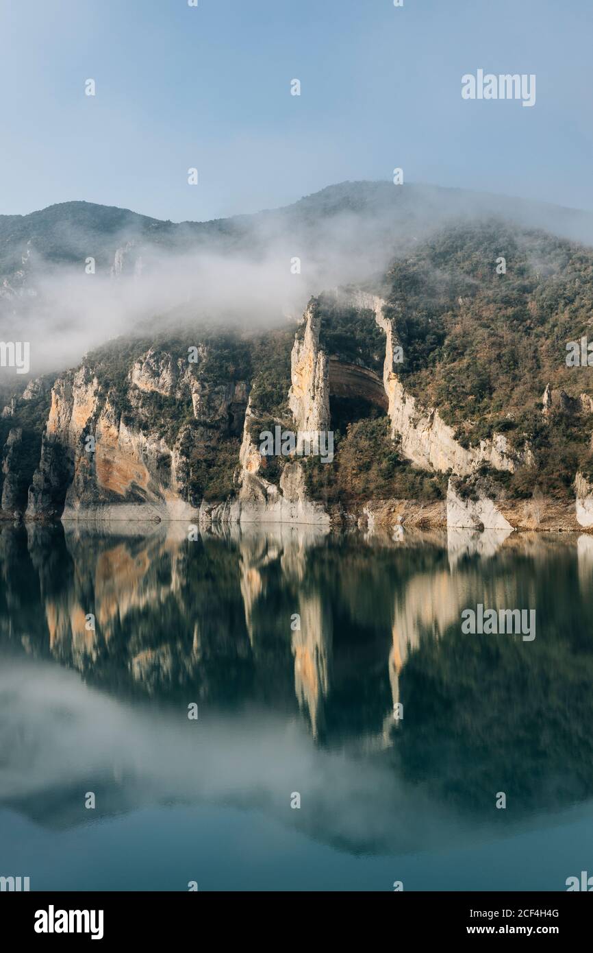 Magnificent landscape of calm lake with mirrored water surface ...