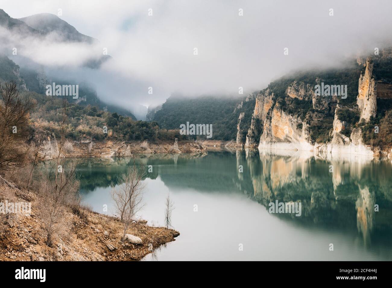 Magnificent landscape of calm lake with mirrored water surface ...