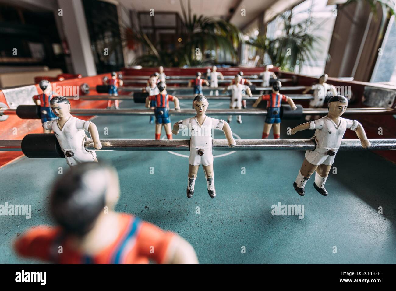 From above closeup of tabletop soccer game with figurines of players ...