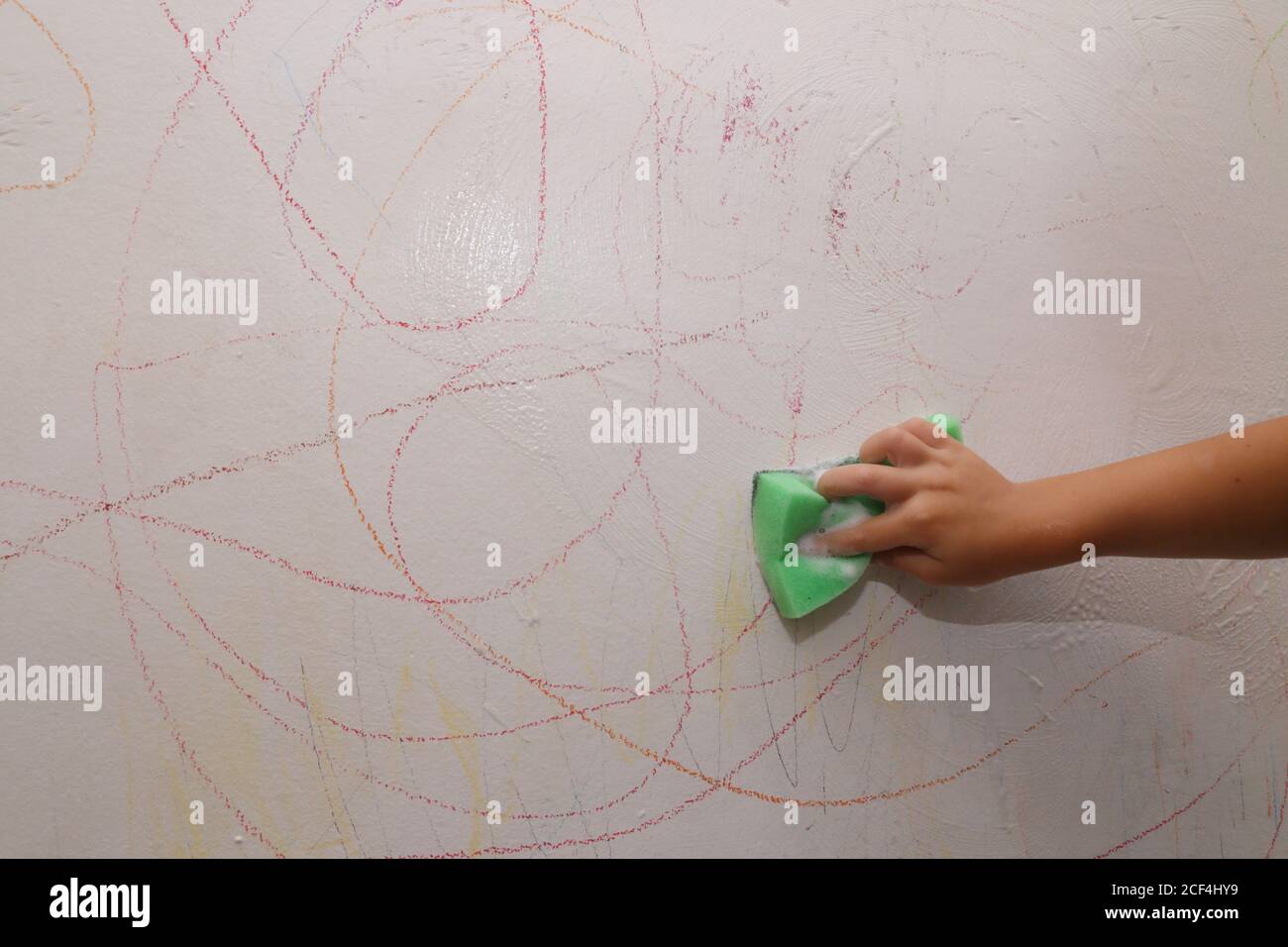 Cleaining white walls from pen scratches Stock Photo - Alamy