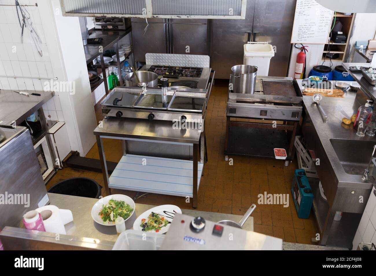 Typical working kitchen interior in restaurant with variety of ...