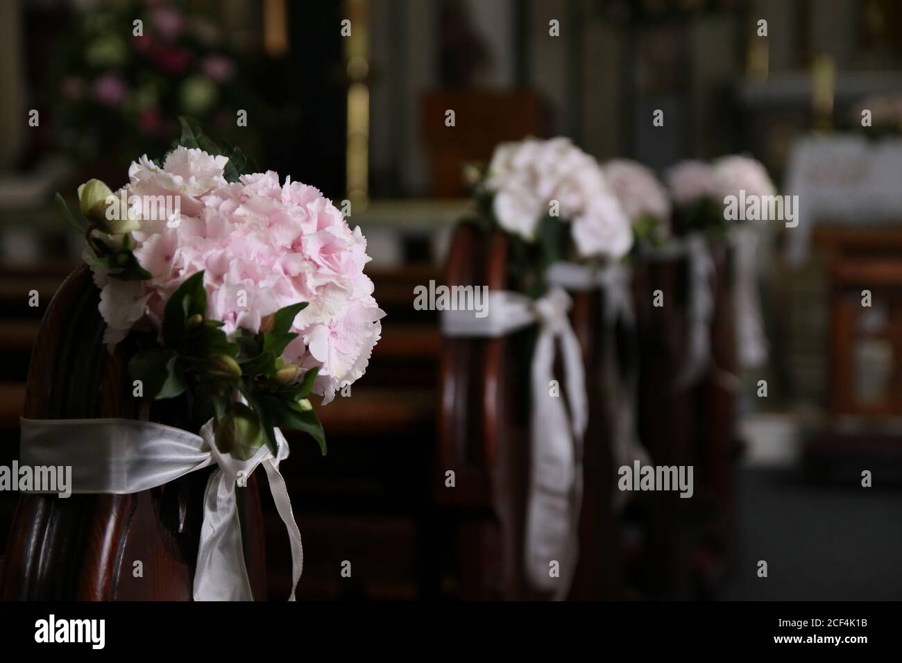 Interior of a catholic church, beautifully decorated with flowers for a ...