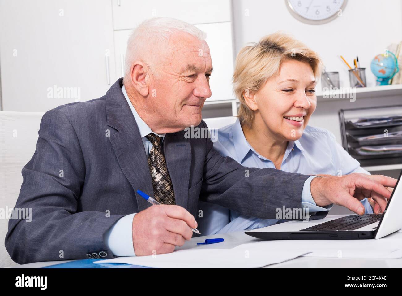 People working productively on business project together in office ...