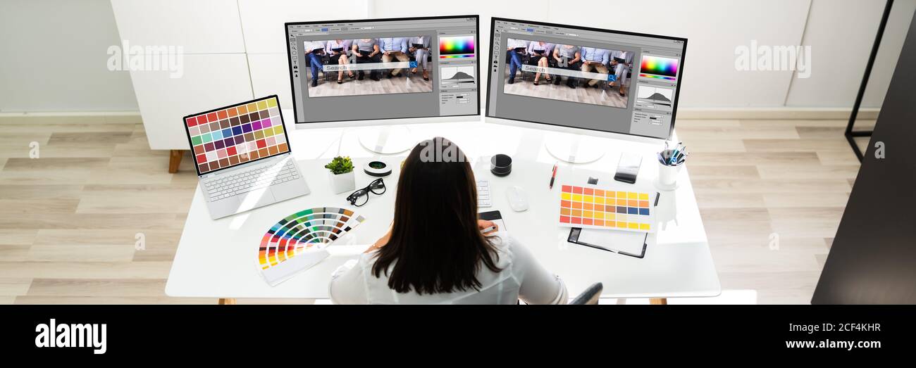 Graphic Designer Artist Working On Multiple Computer Screens Stock ...
