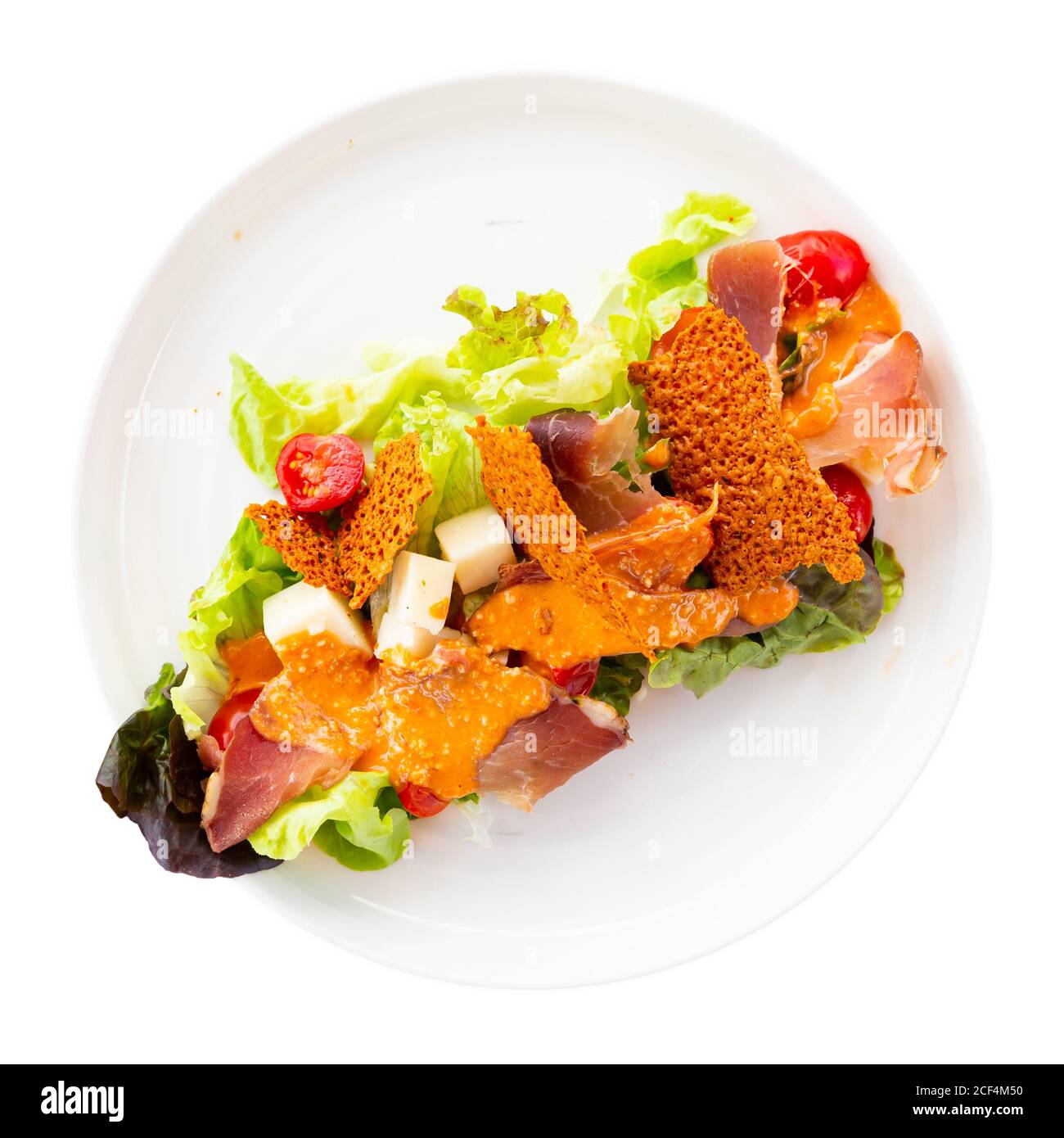 Traditional French cuisine, Basque salad with sliced smoked bacon ...