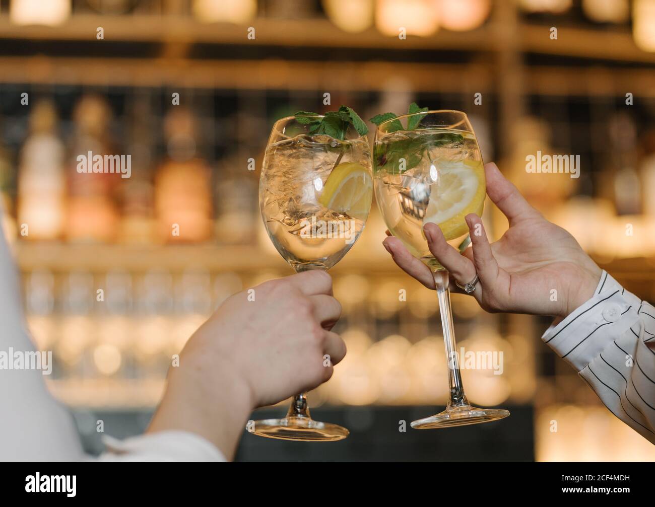 Back view friends clinking glasses hi-res stock photography and images ...