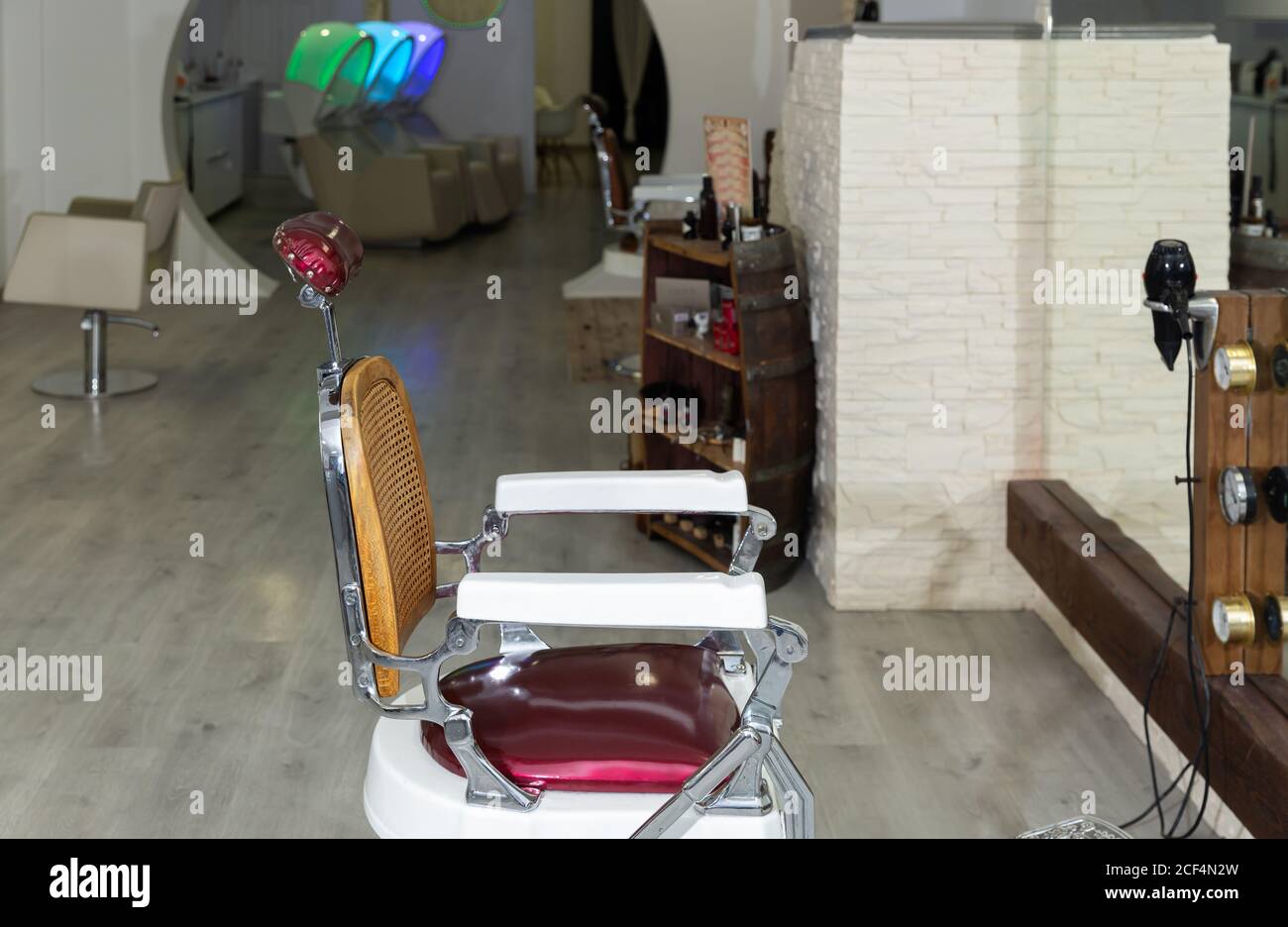 Interior of modern light beauty salon, empty space with chairs and hair ...