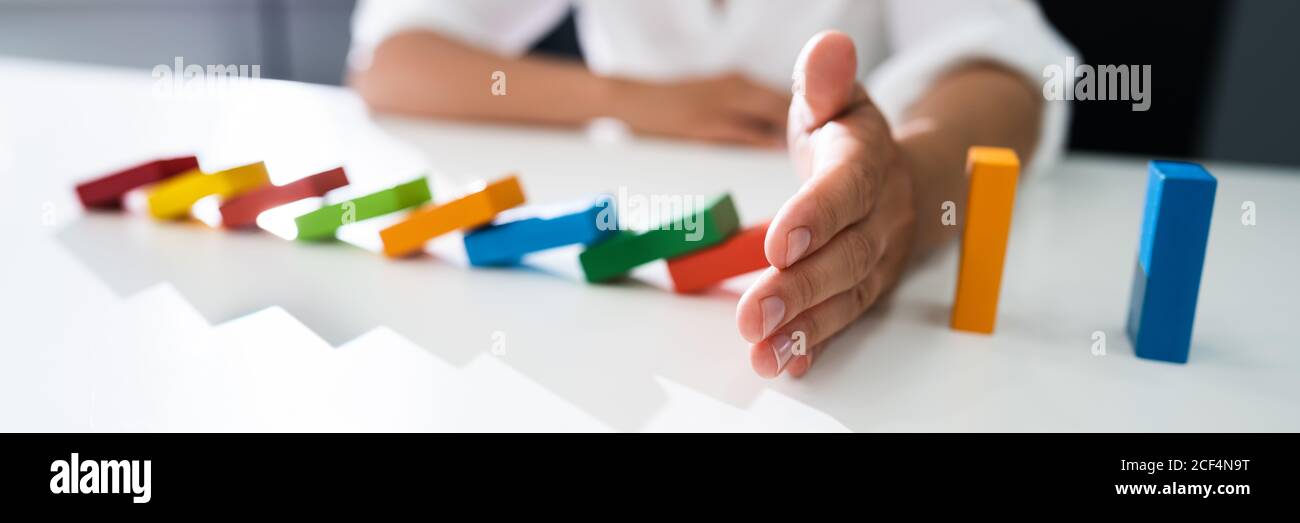 Domino Game Risk Stop. Prevent Fall. Chain Effect Stock Photo - Alamy