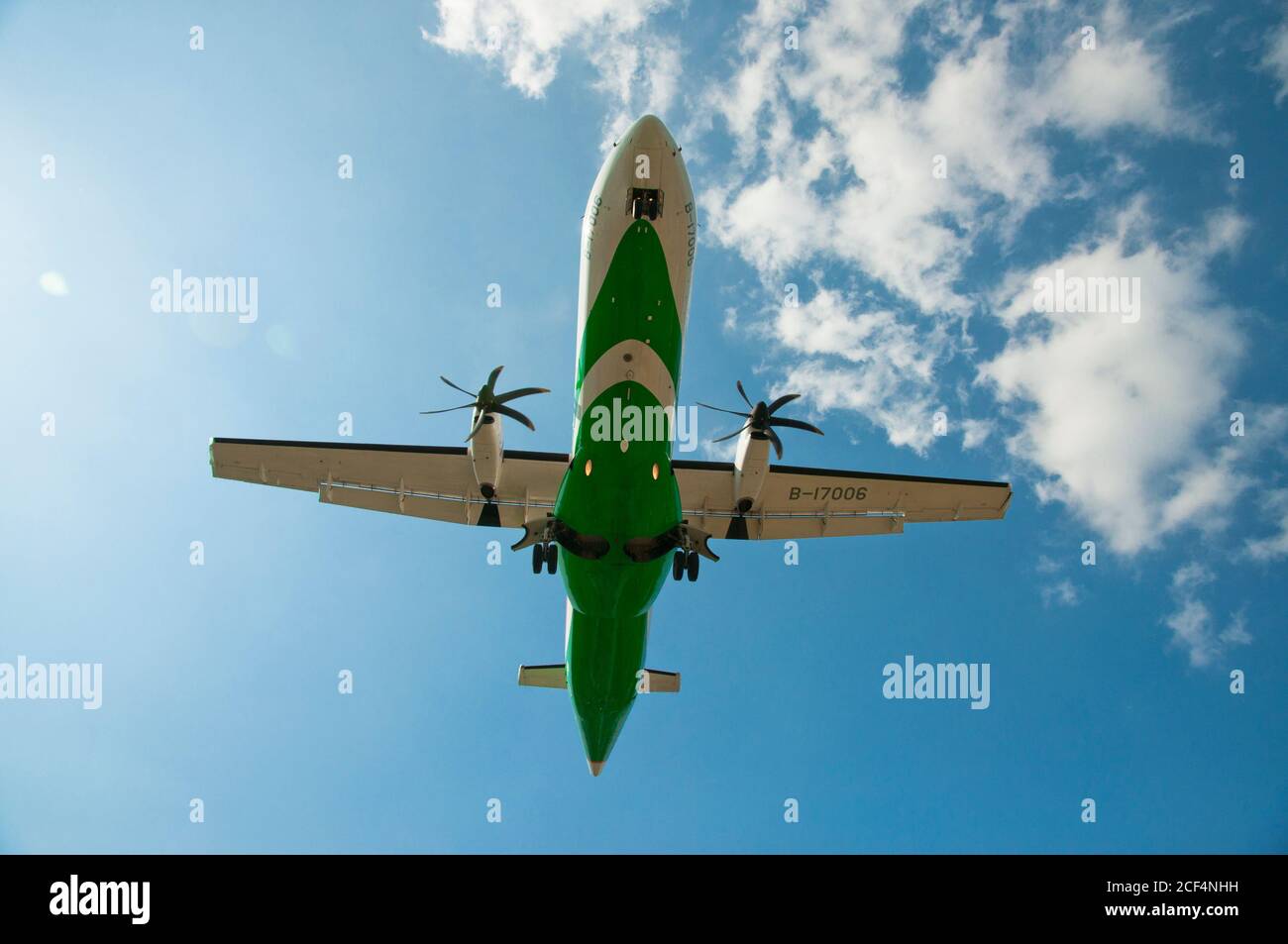 airplane approaching landing strip with landing gear out Stock Photo ...