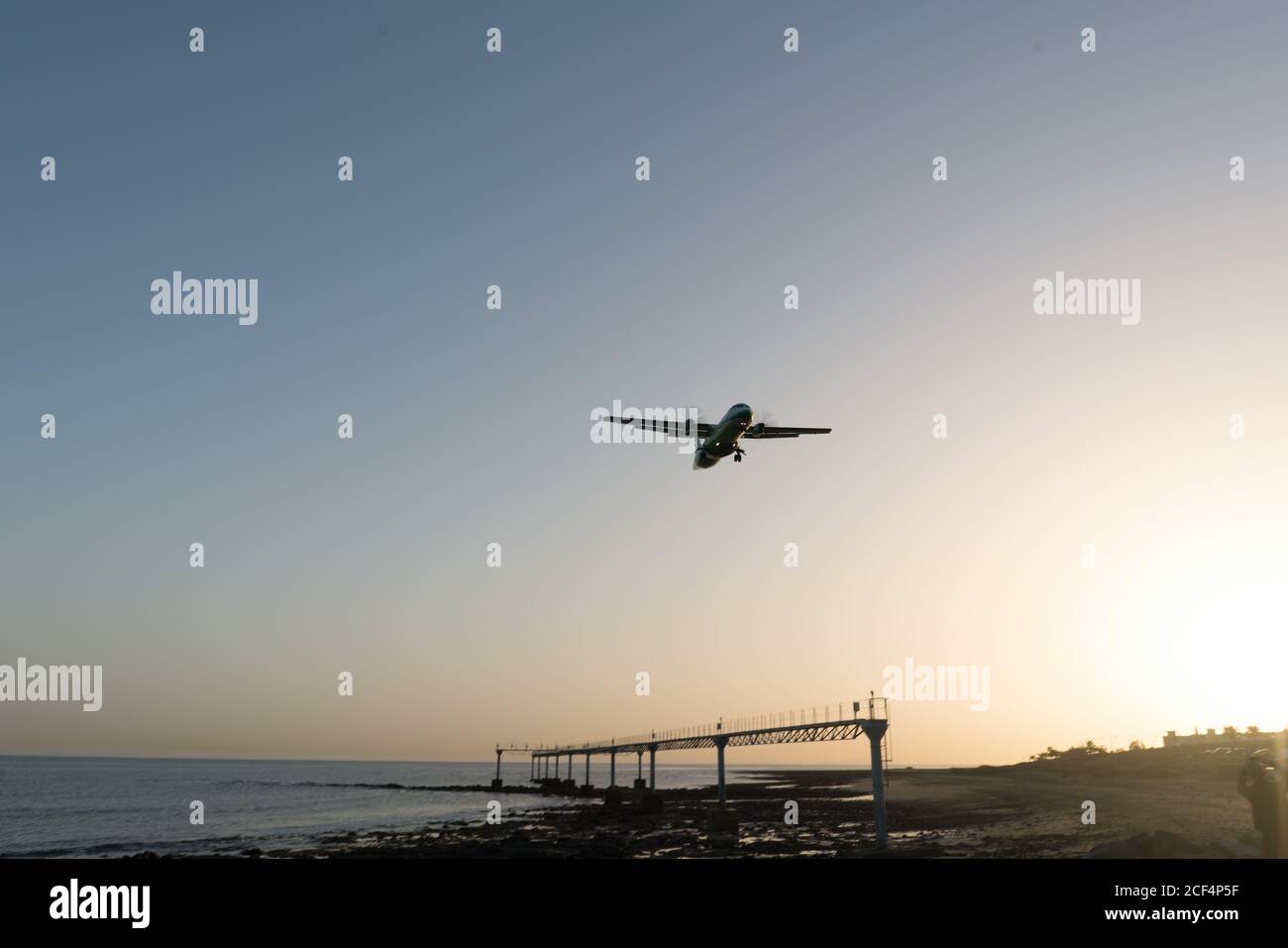 Plane behind security fence Stock Photo - Alamy