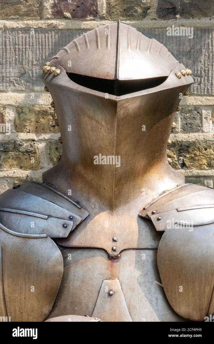 a suit of armour in the medieval style with a close helmet and ...
