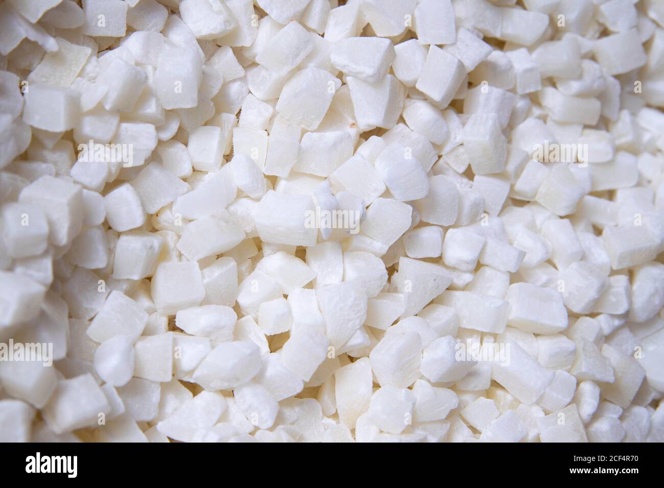 Sweet dried cubes of coconut fruit, dried coconut pieces background ...