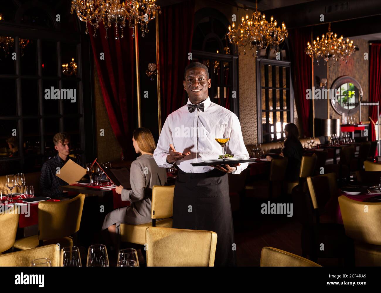 African waiter woman restaurant plate hi-res stock photography and ...