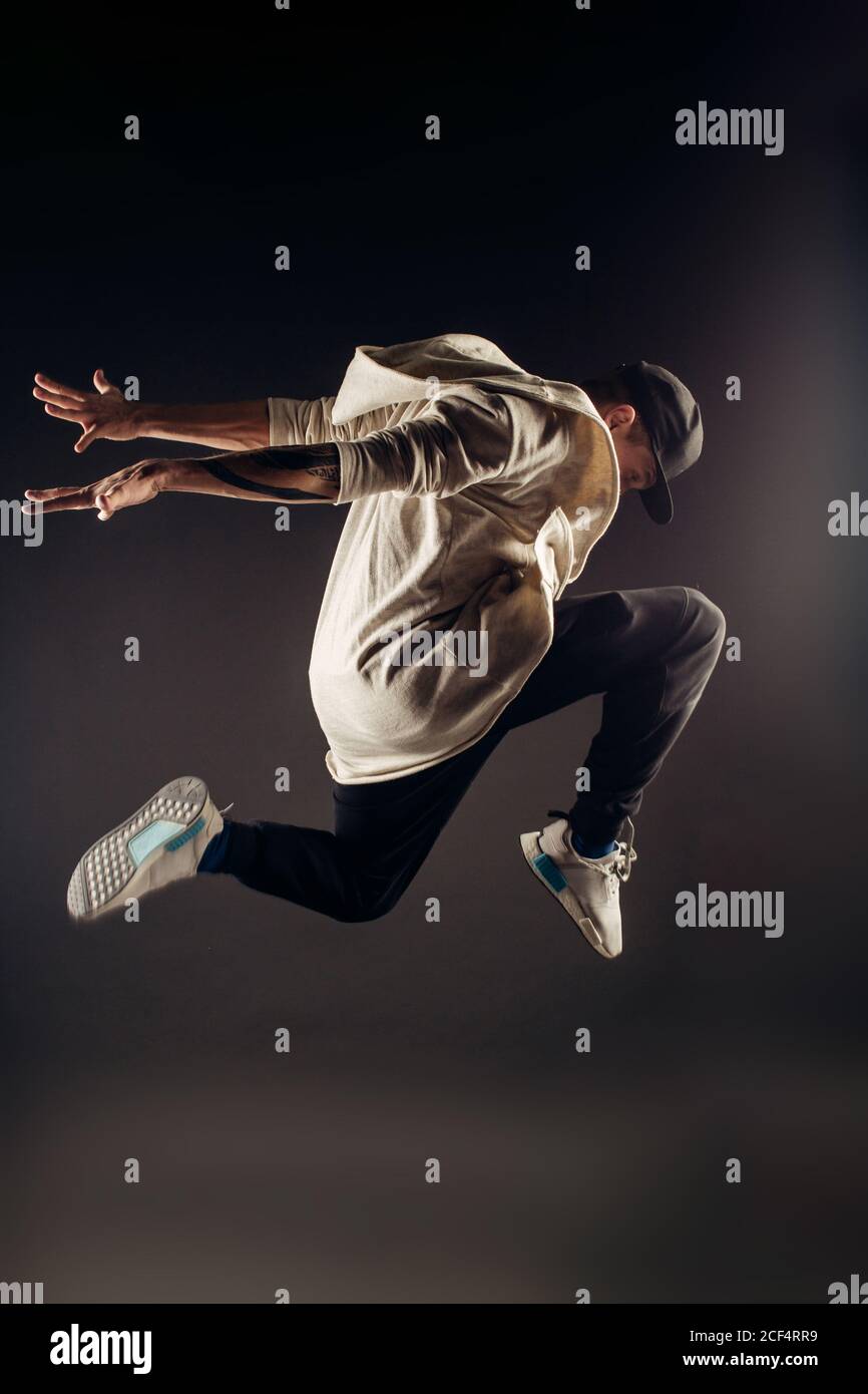 Sporty hip-hop dancer jumping Stock Photo - Alamy