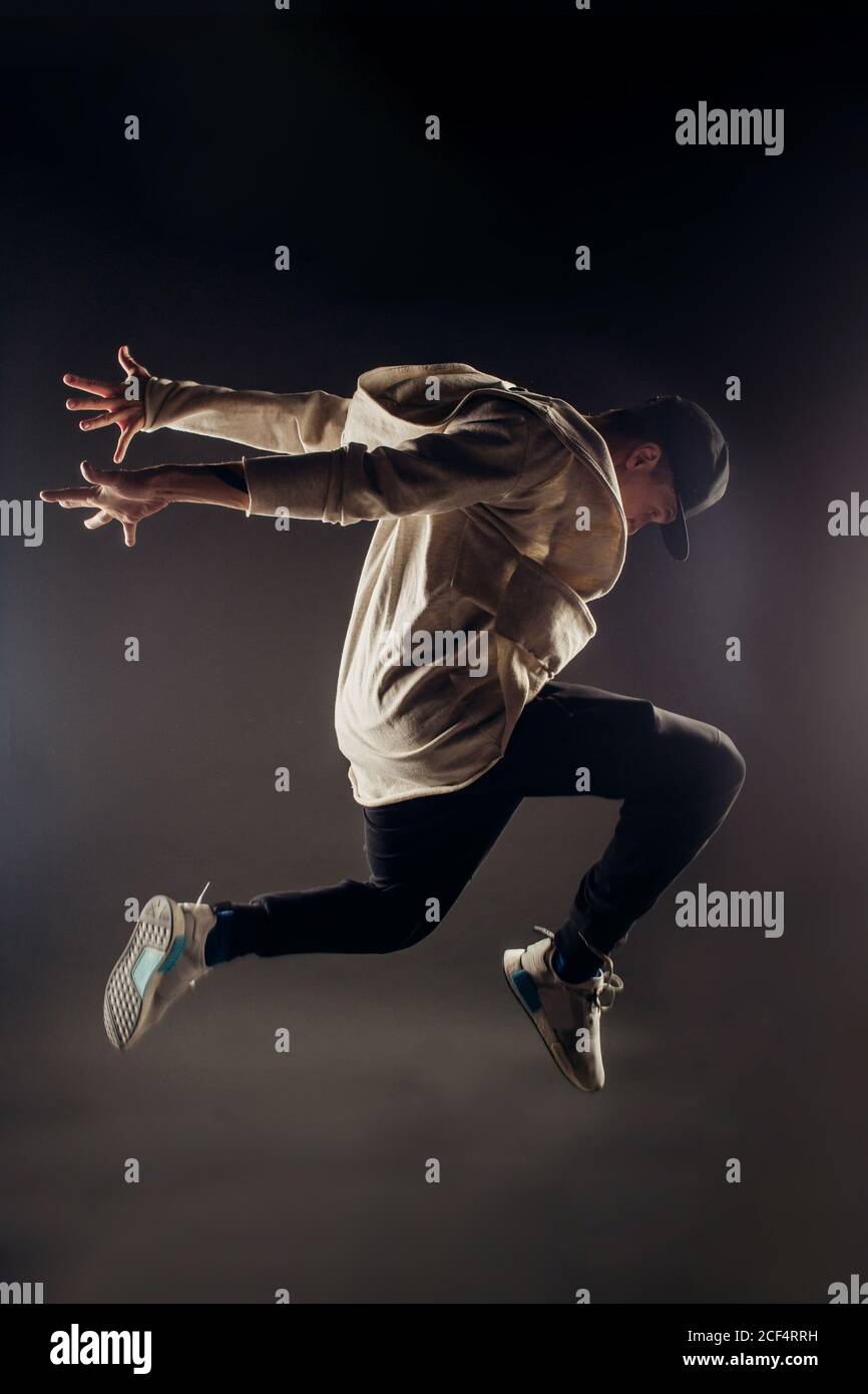 modern style dancer jumping on studio background Stock Photo - Alamy