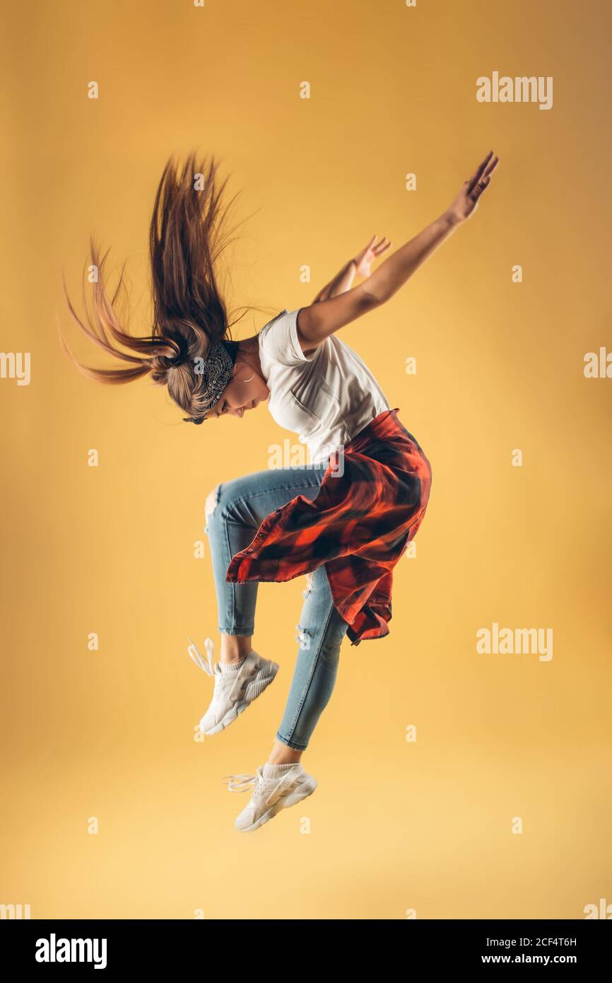 beautiful young girl dancing jumping Stock Photo - Alamy