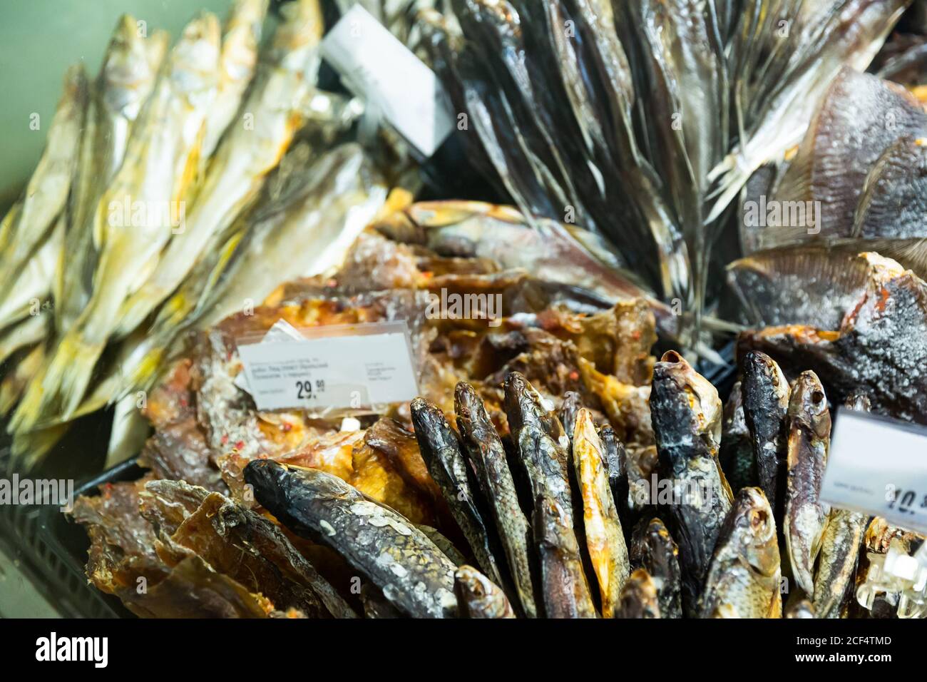 Dried salted freshwater fish on store counter. Traditional Russian ...