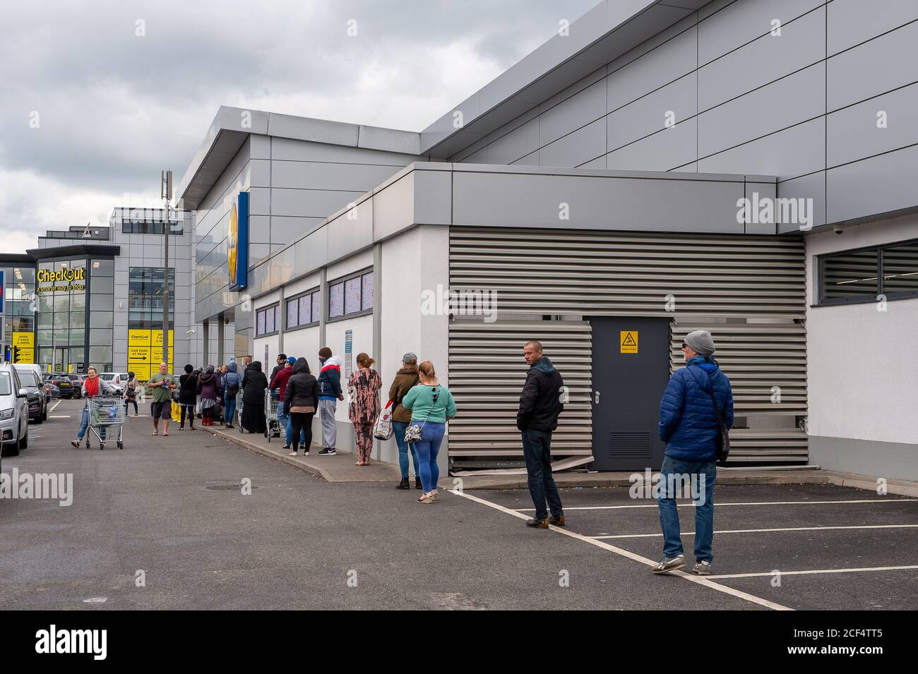Slough, Berkshire, UK. 1st May, 2020. Long queues formed outside the ...