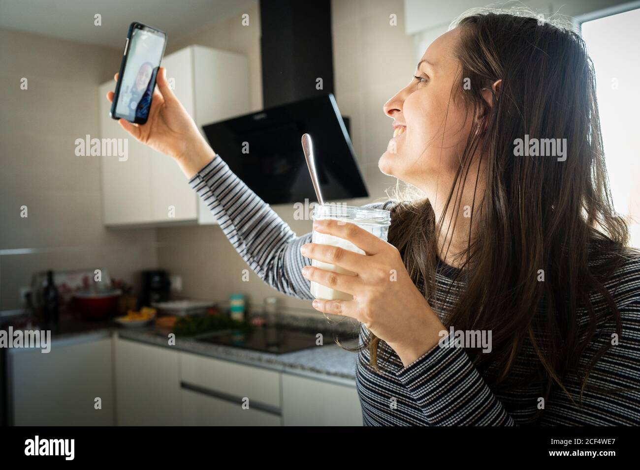 Woman yogurt smiling hi-res stock photography and images - Alamy