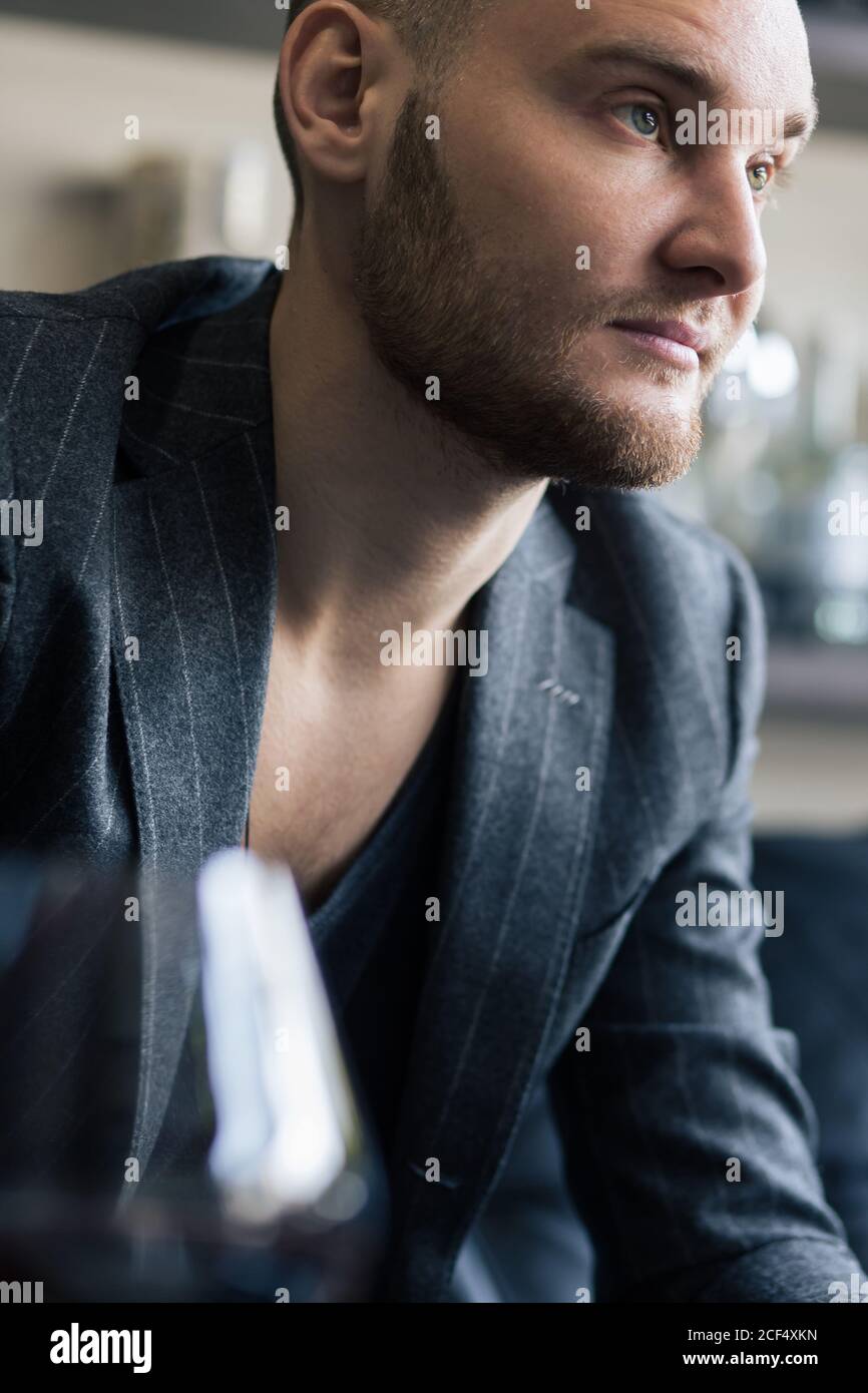 Side view portrait of thinking stylish young man looking away Stock ...
