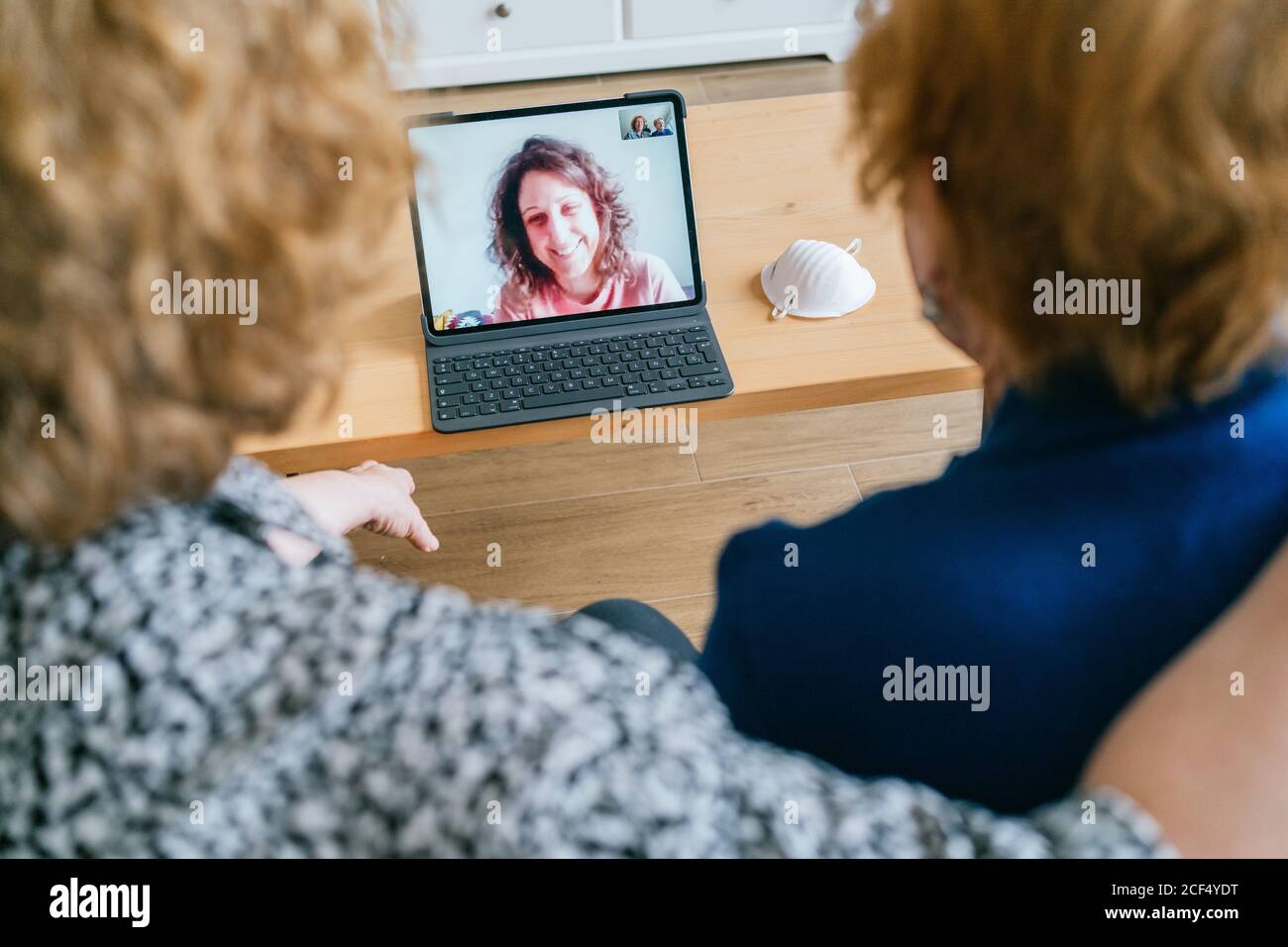 Women having video conversation on laptop at home Stock Photo - Alamy