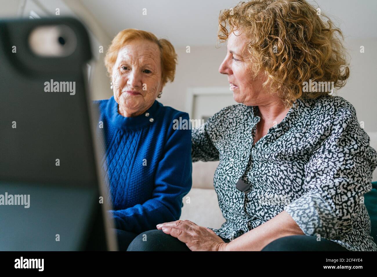 Women having video conversation on laptop at home Stock Photo - Alamy