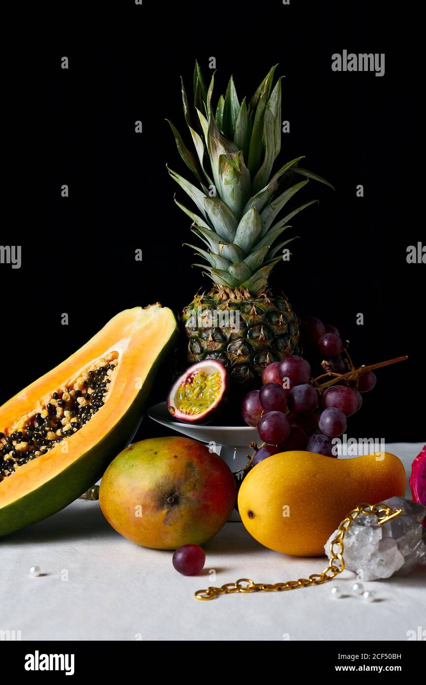 Still life with tropical fruits, gems and various objects Stock Photo ...