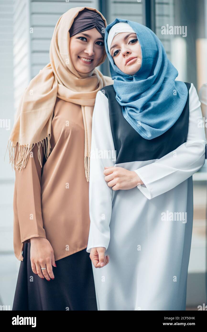 Two muslim in hijab friends in the park. looking in the camera Stock ...