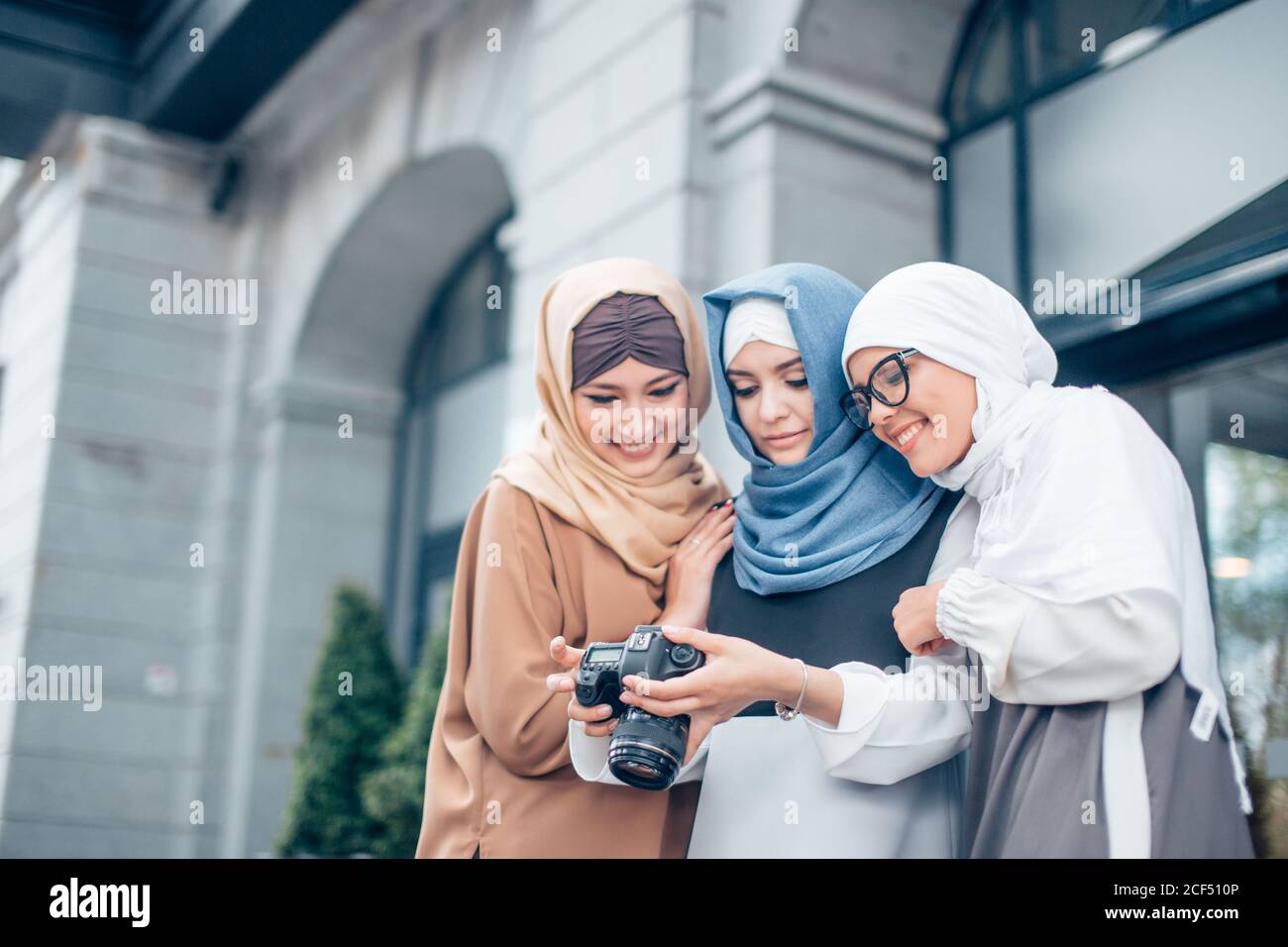 Traveling and photography. Young muslim women in beautiful hijab ...