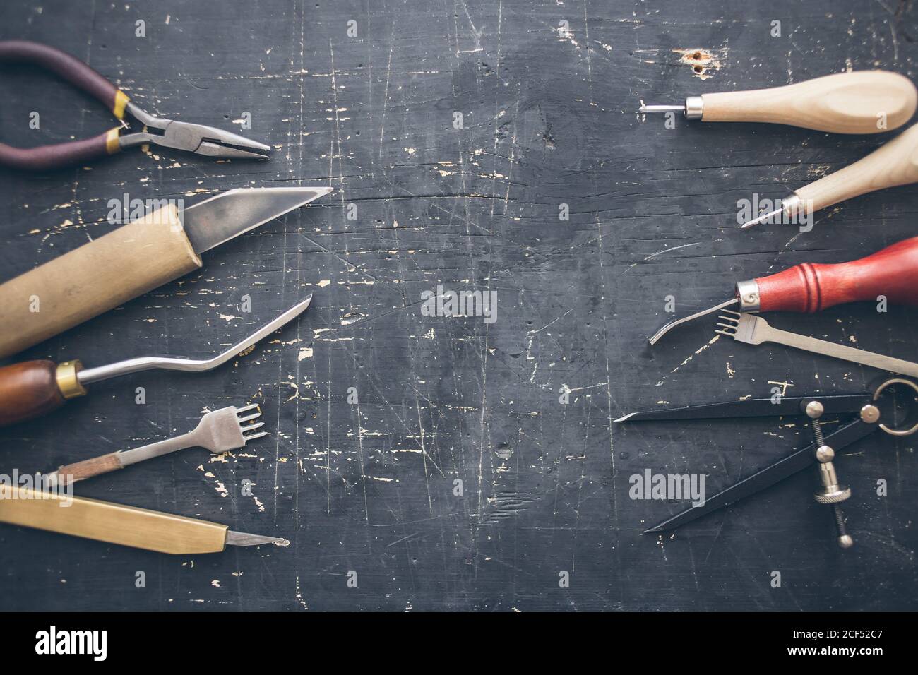 Leather craft tools on a wooden background. with copyspase Stock Photo ...