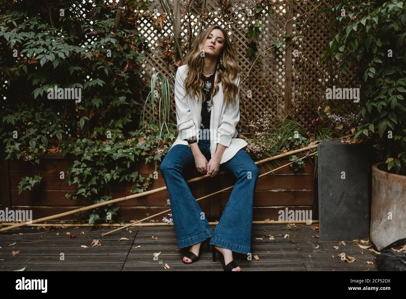 Female on garden planter hi-res stock photography and images - Alamy