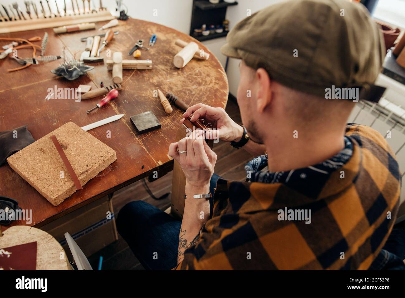 Professional crafter making leather items Stock Photo - Alamy