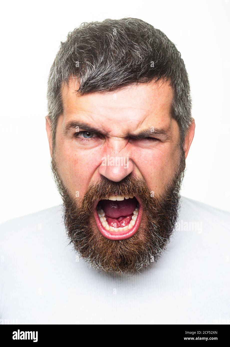 Angry Barber with long beard and moustache in barbershop. Bearded ...