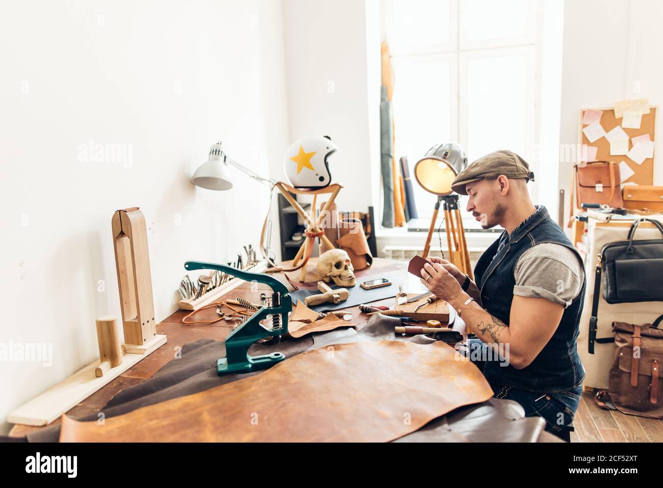 Professional crafter making leather items Stock Photo - Alamy