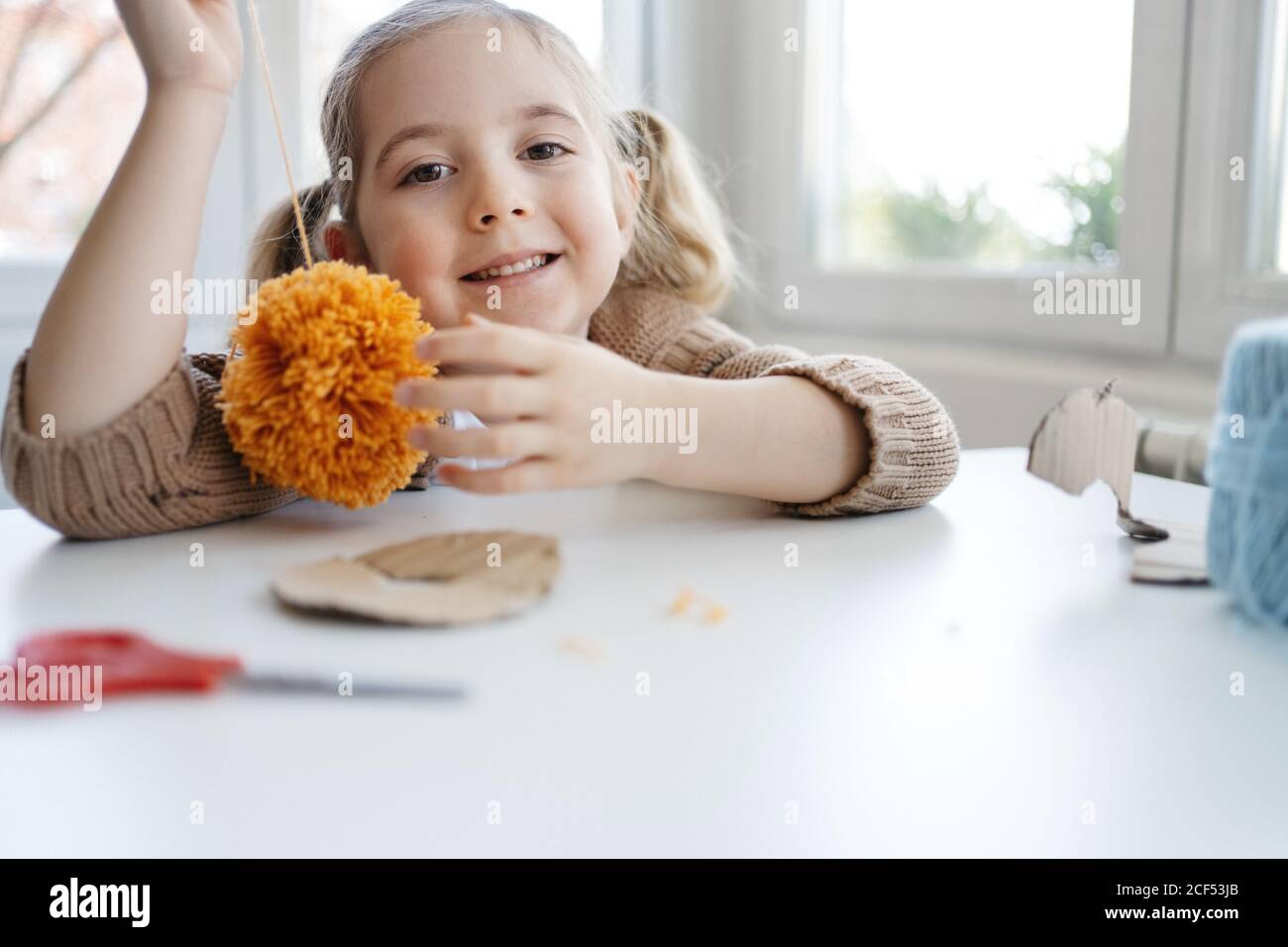 Girl wool craft pompom hi-res stock photography and images - Alamy