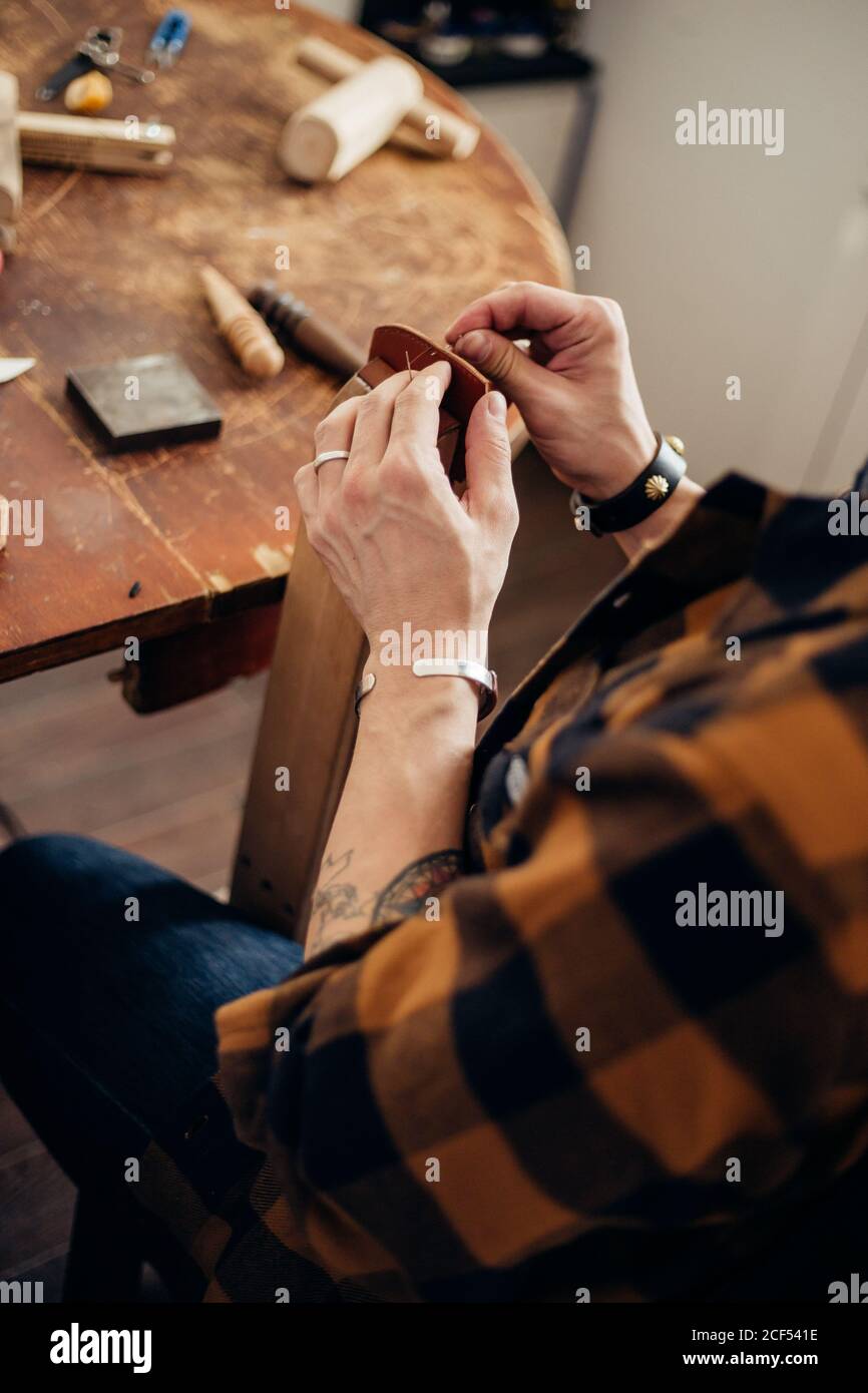 Professional crafter making leather items Stock Photo - Alamy