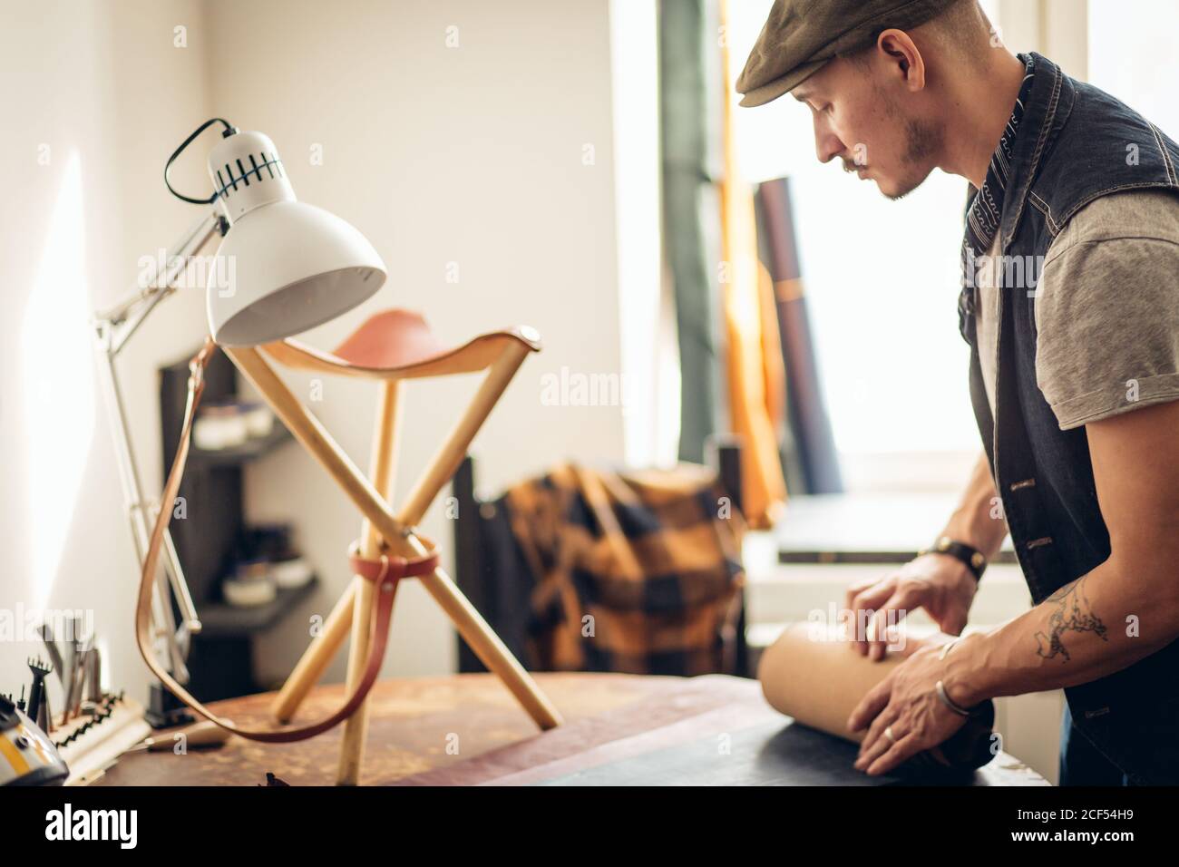 Professional crafter making leather items Stock Photo - Alamy