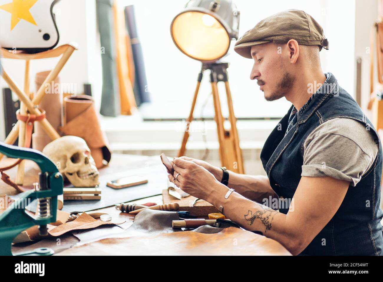 portrait of muscular middle eastern mustache man wearing creative cup ...
