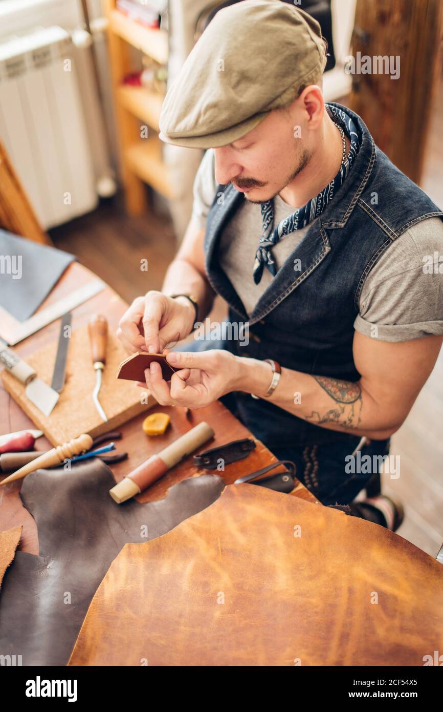 portrait of muscular middle eastern mustache man wearing creative cup ...