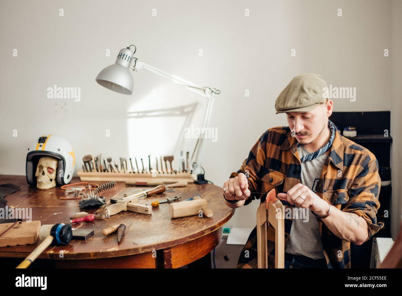 Professional crafter making leather items Stock Photo - Alamy