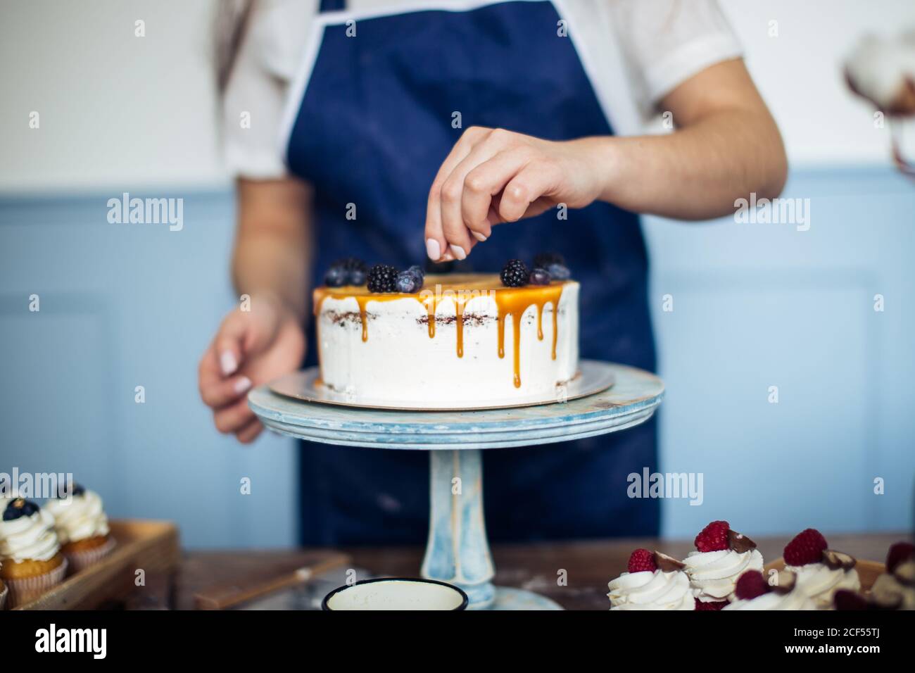 the process of decorating cupcakes Stock Photo - Alamy