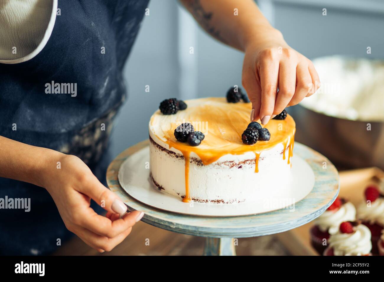 Professional cook making cupcakes hi-res stock photography and images ...