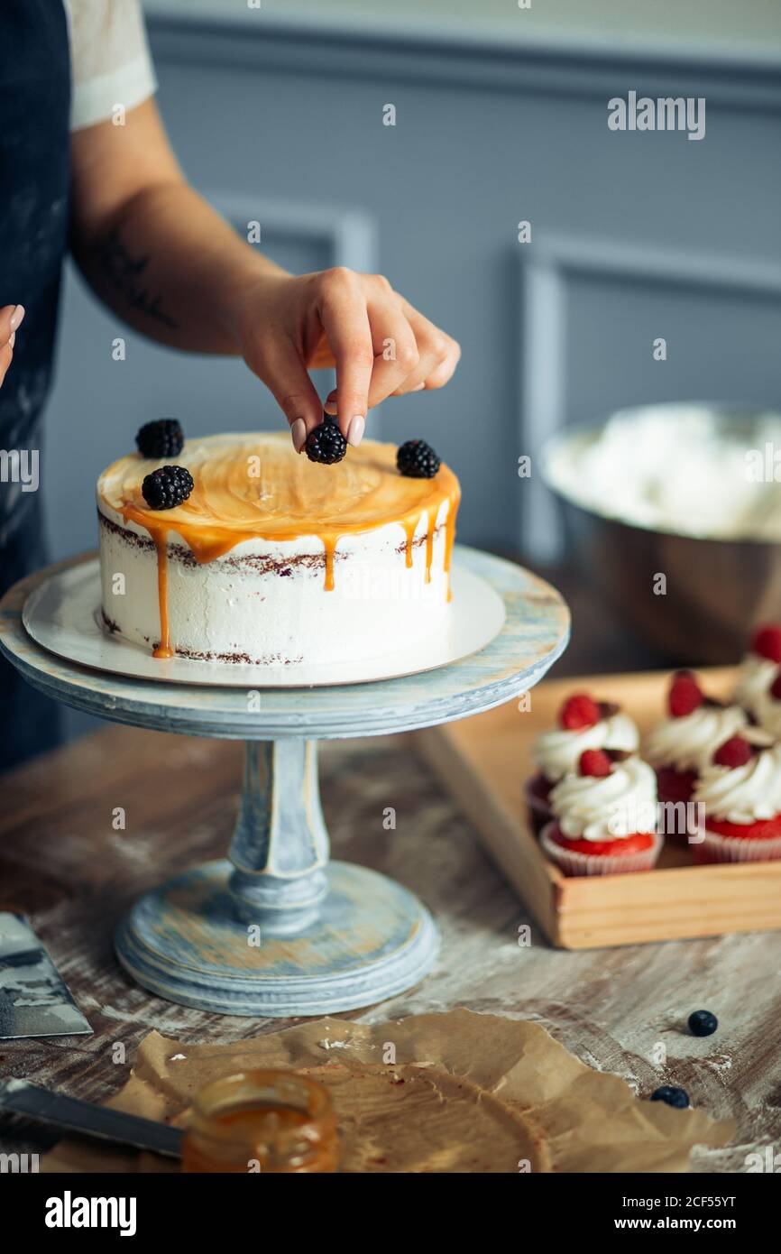 the process of decorating cupcakes Stock Photo - Alamy