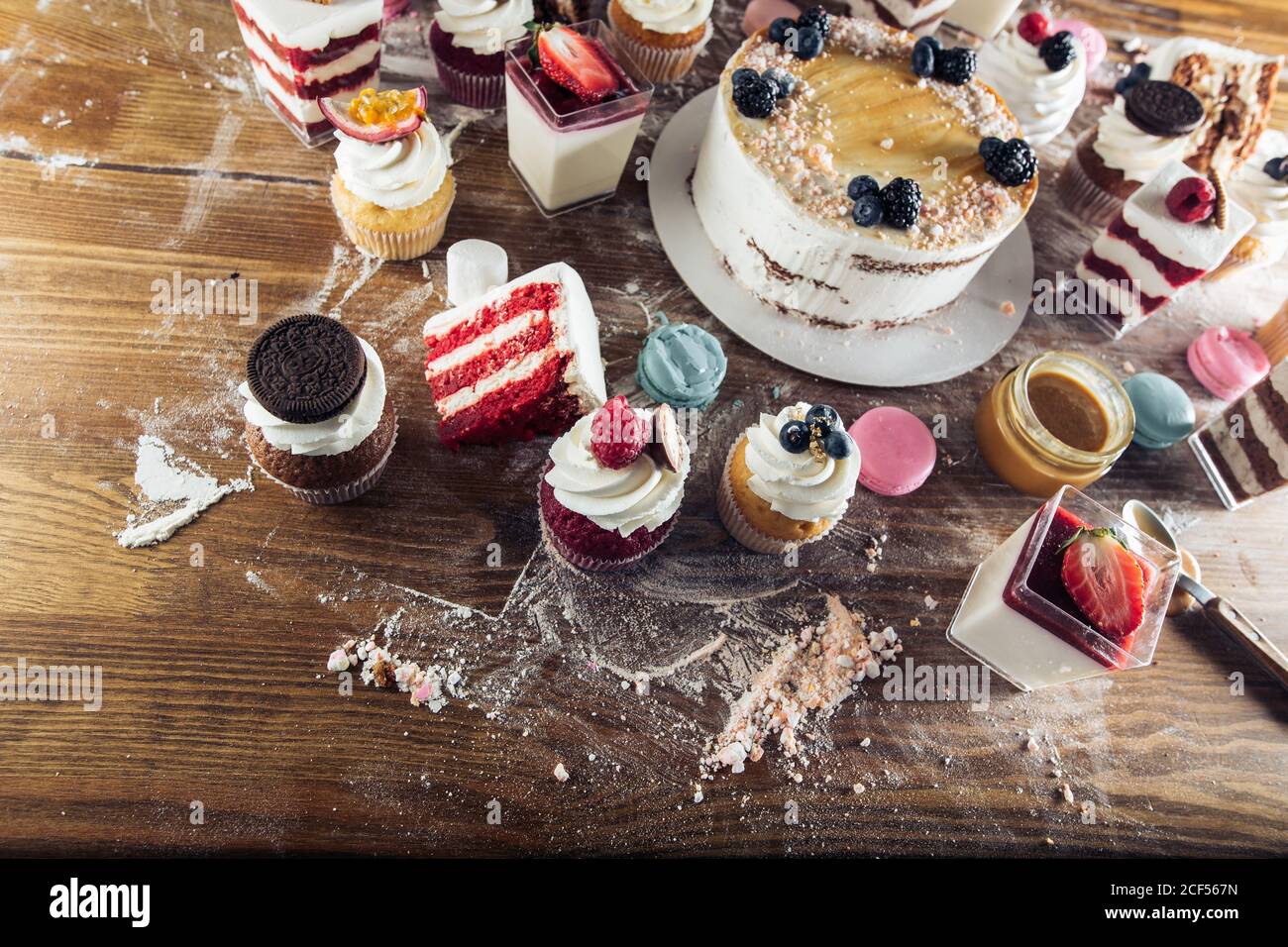 Table with loads of cakes, cupcakes, cookies and cakepops Stock Photo ...