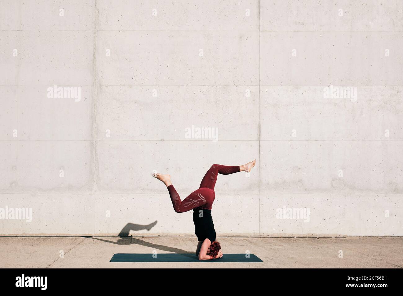 Side view of unrecognizable barefooted female athlete in activewear ...