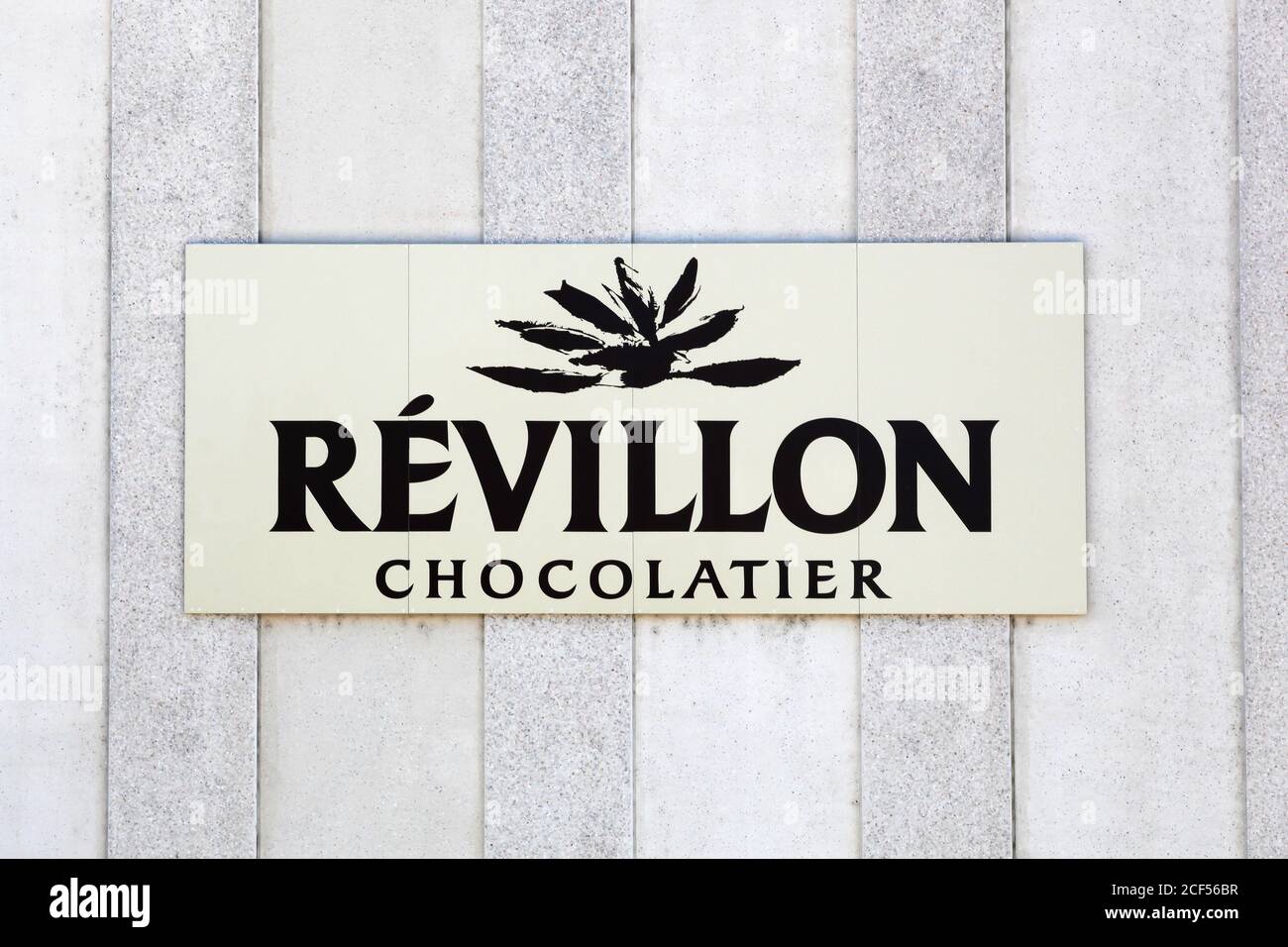 Roanne, France - July 5, 2020: Revillon logo on a wall. Revillon is a ...