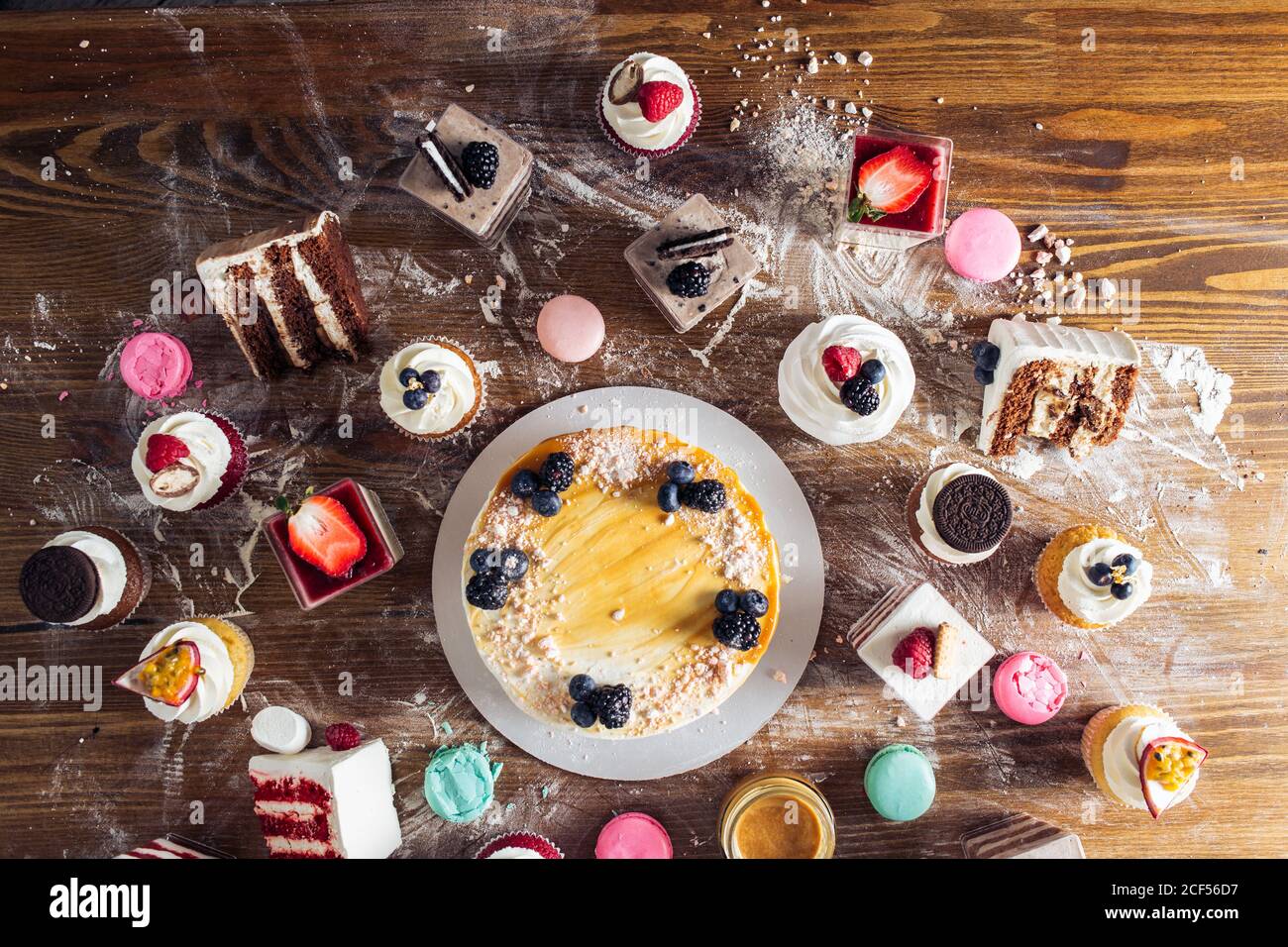 Table with loads of cakes, cupcakes, cookies and cakepops Stock Photo ...