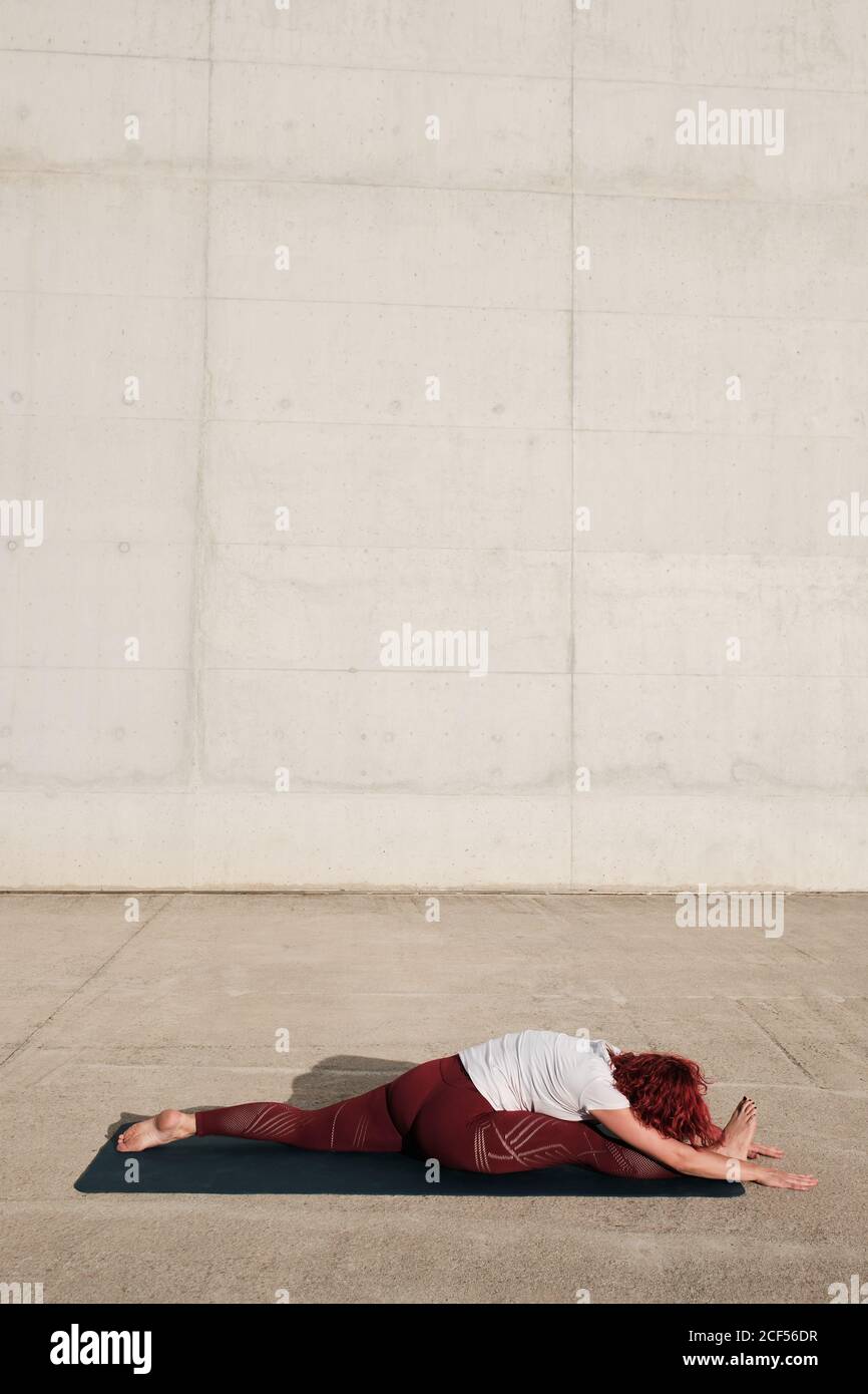 Monkey pose forward bend hi-res stock photography and images - Alamy